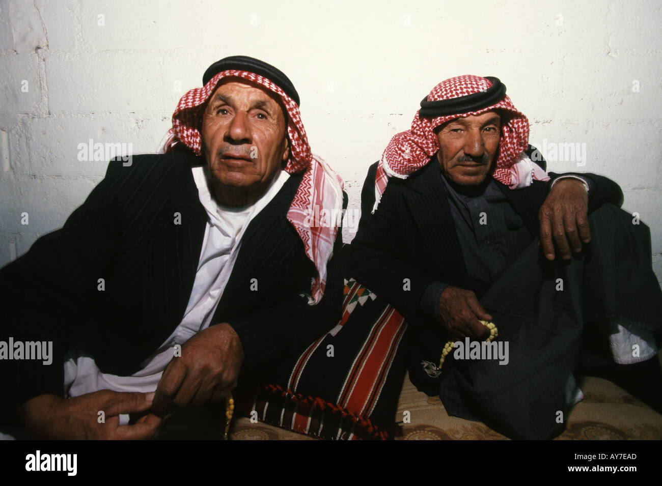 Two Jordanian village or Bedouin men sitting on floor in house in ...