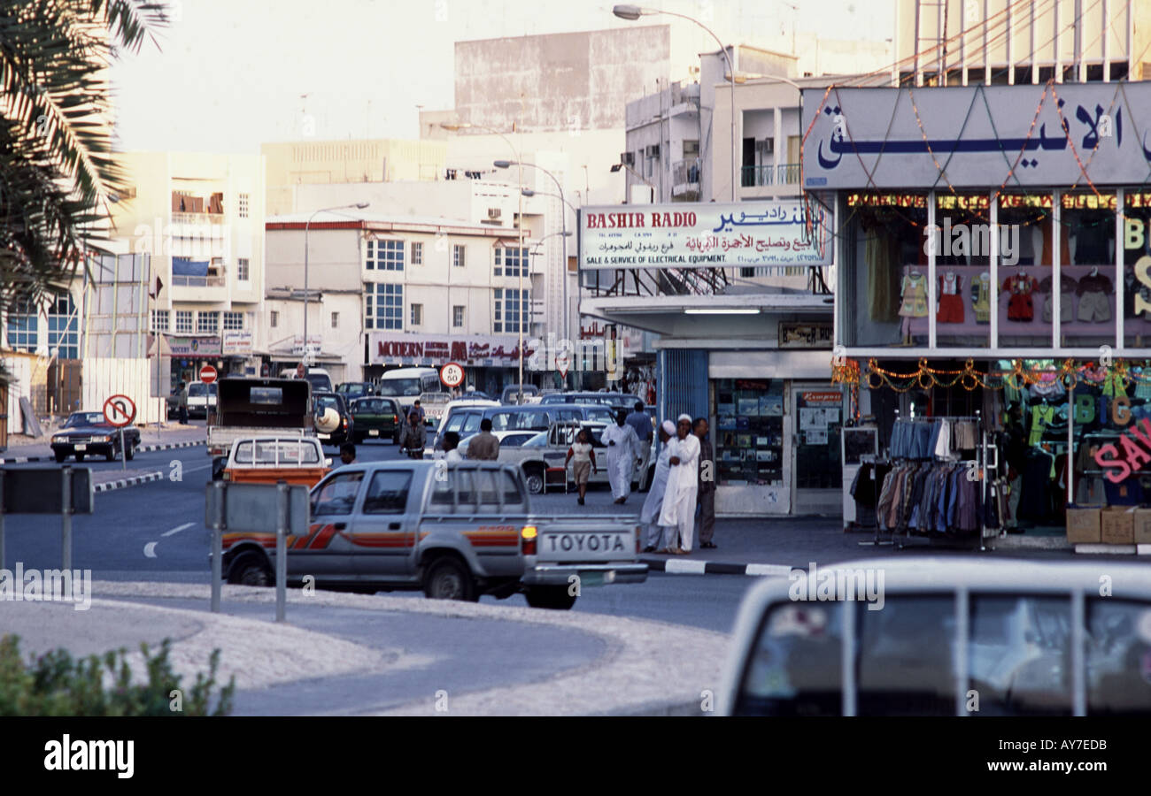 Shops and pedestrians general street scene in downtown Doha Qatar Stock ...