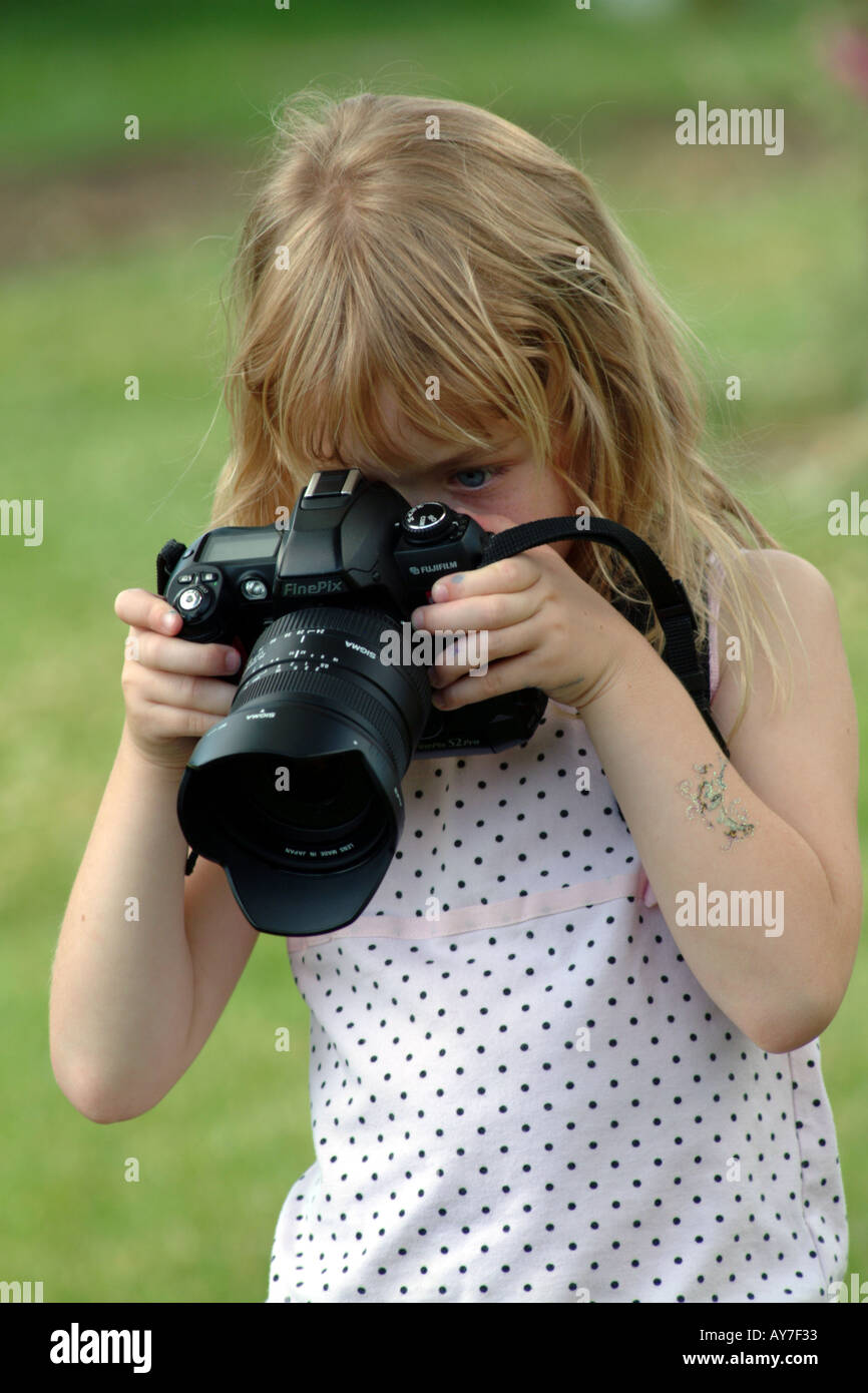 Little Girl Using SLR Digital Camera Stock Photo - Alamy