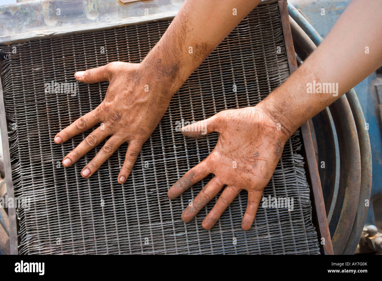 Dirty female hands against grill Stock Photo - Alamy