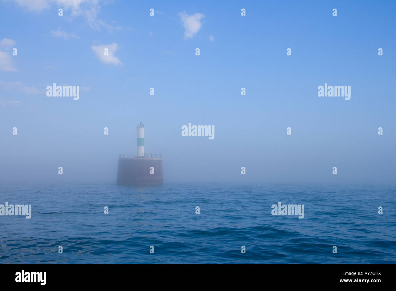 Lighthouse in fog Stock Photo - Alamy
