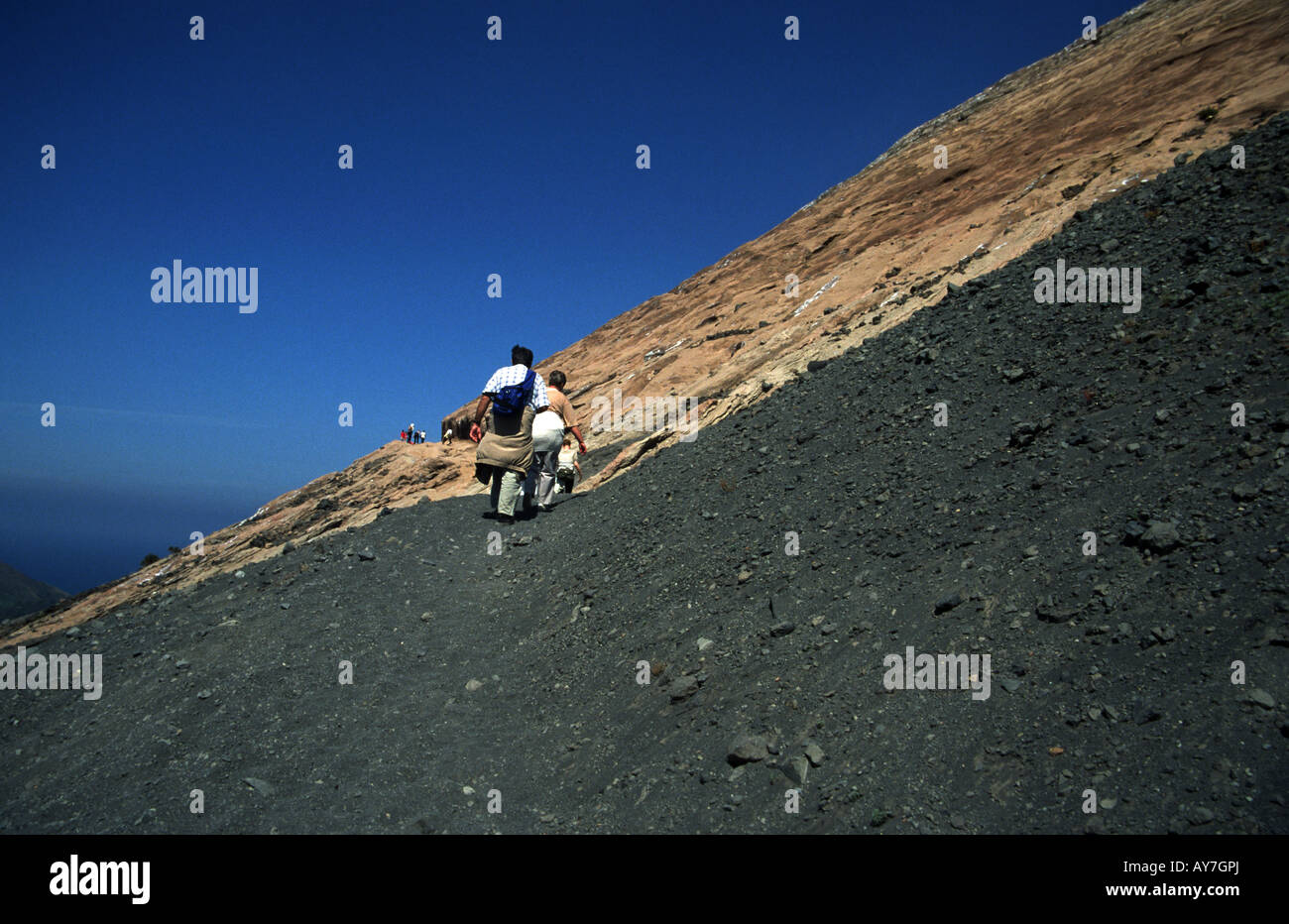 People hiking on the mountain in the island of Lipari, Sicily, Italy ...