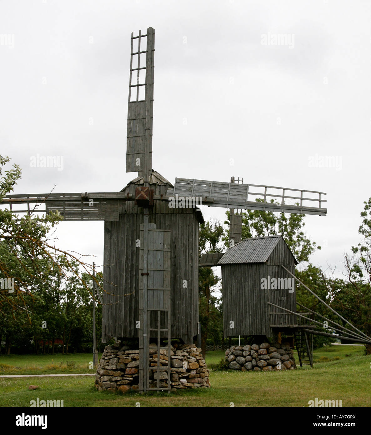 Small windmills in a grass pasture Stock Photo - Alamy