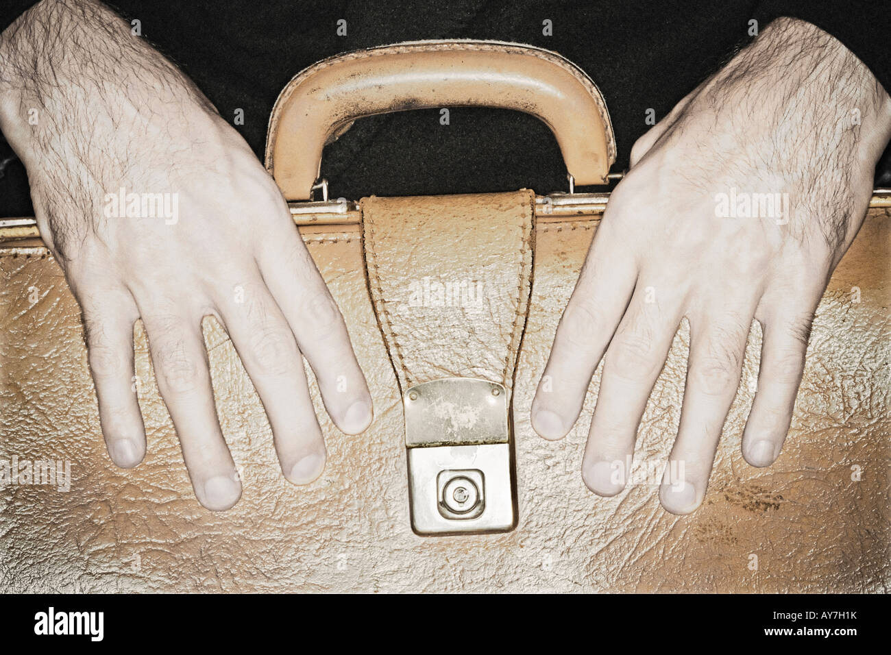 Hands Of Businessman Holding Briefcase Stock Photo - Alamy