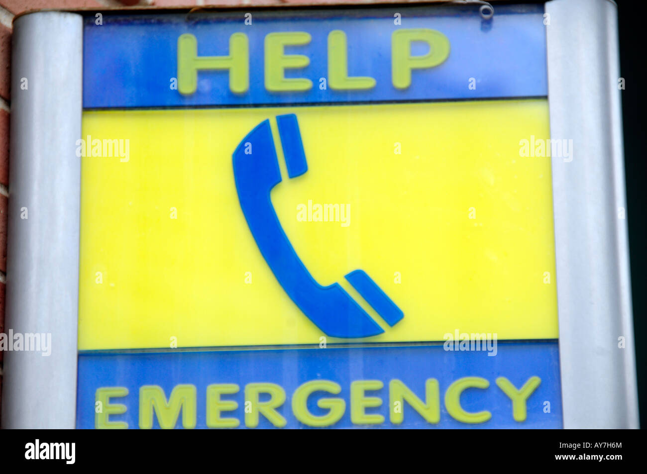 A help sign, yellow and blue coloring mixed across the emergency words ...