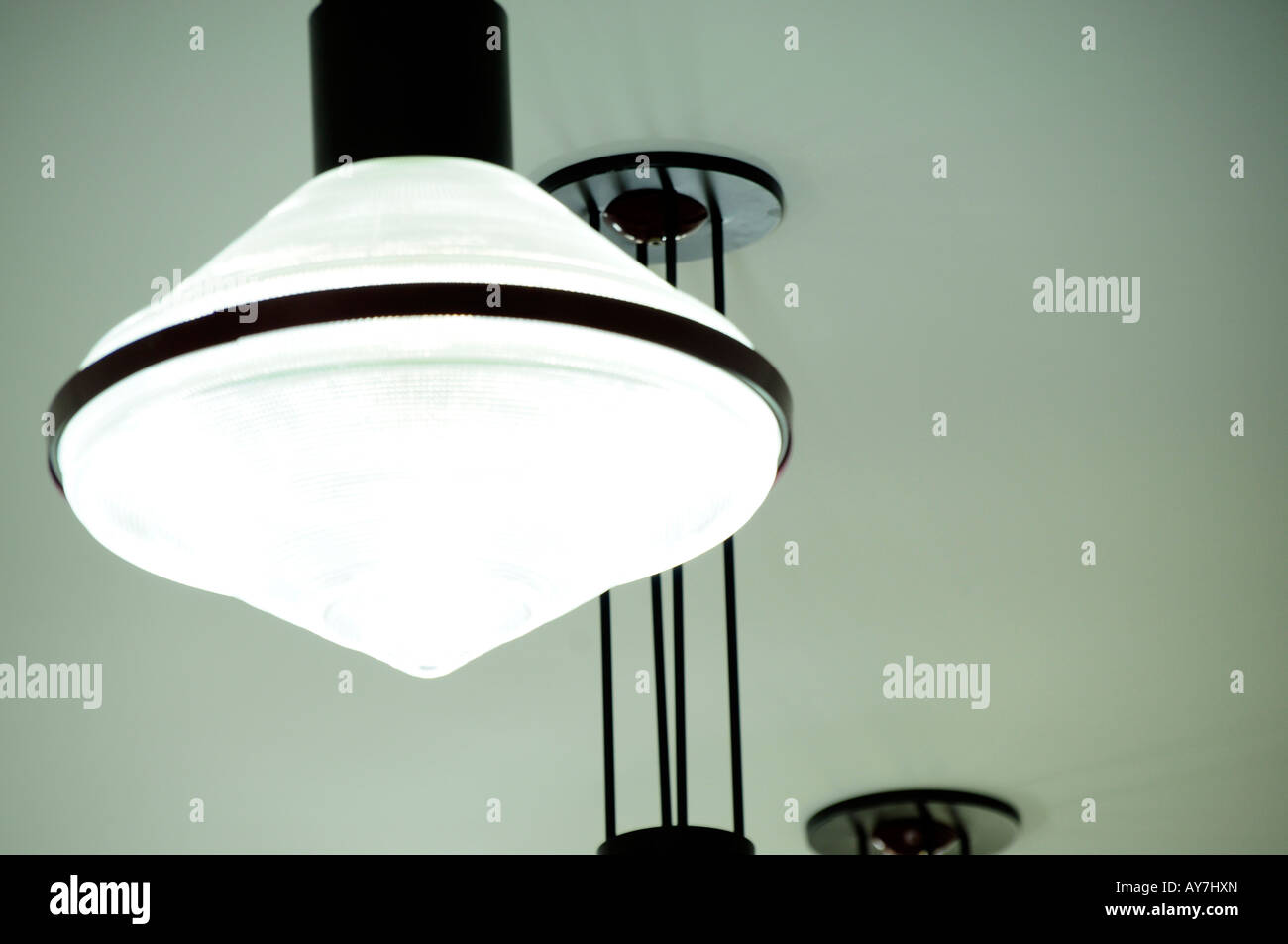 First light in a row of ceiling lamps Stock Photo - Alamy