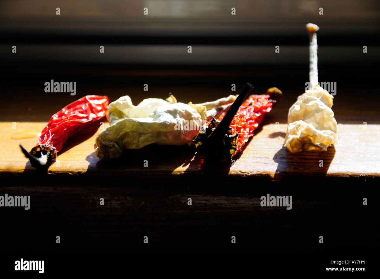 Red and green peppers, drying on a windowsill.Pepper, red, green ...