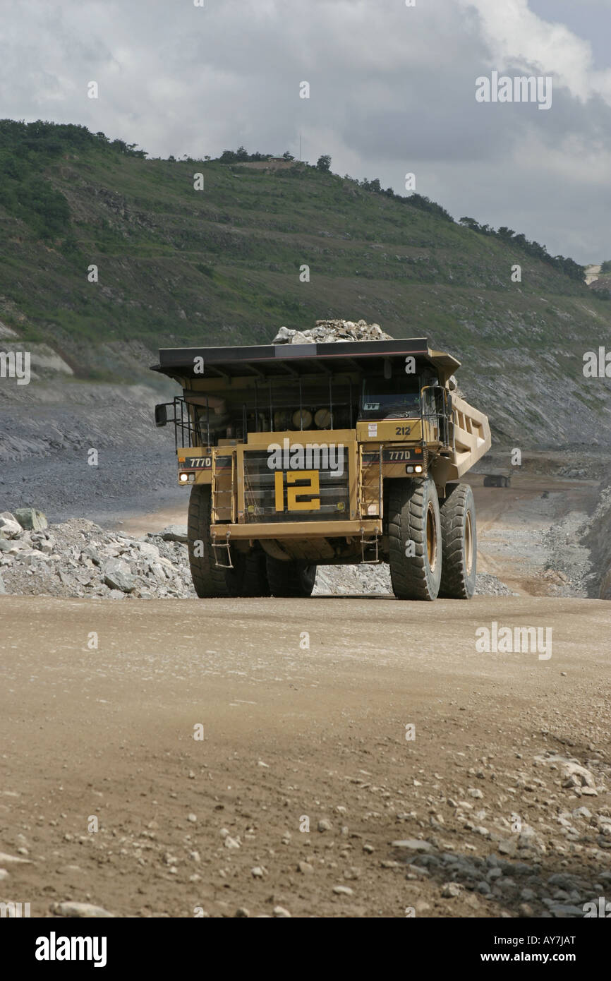 Dumper haul truck transporting from opencast pit after blasting to ...