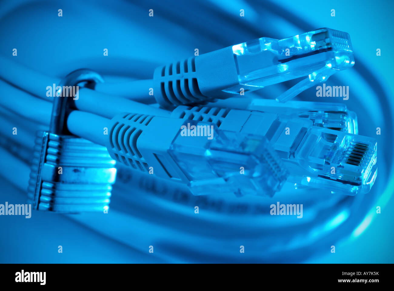 A high tech blue tint closeup of nertwork cables surrounded by a ...