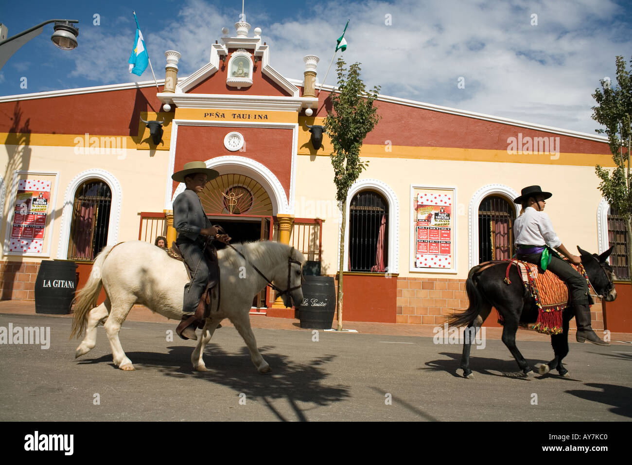 Young boy and girl riding ponies at the Fuengirola Feria – Spain Stock ...
