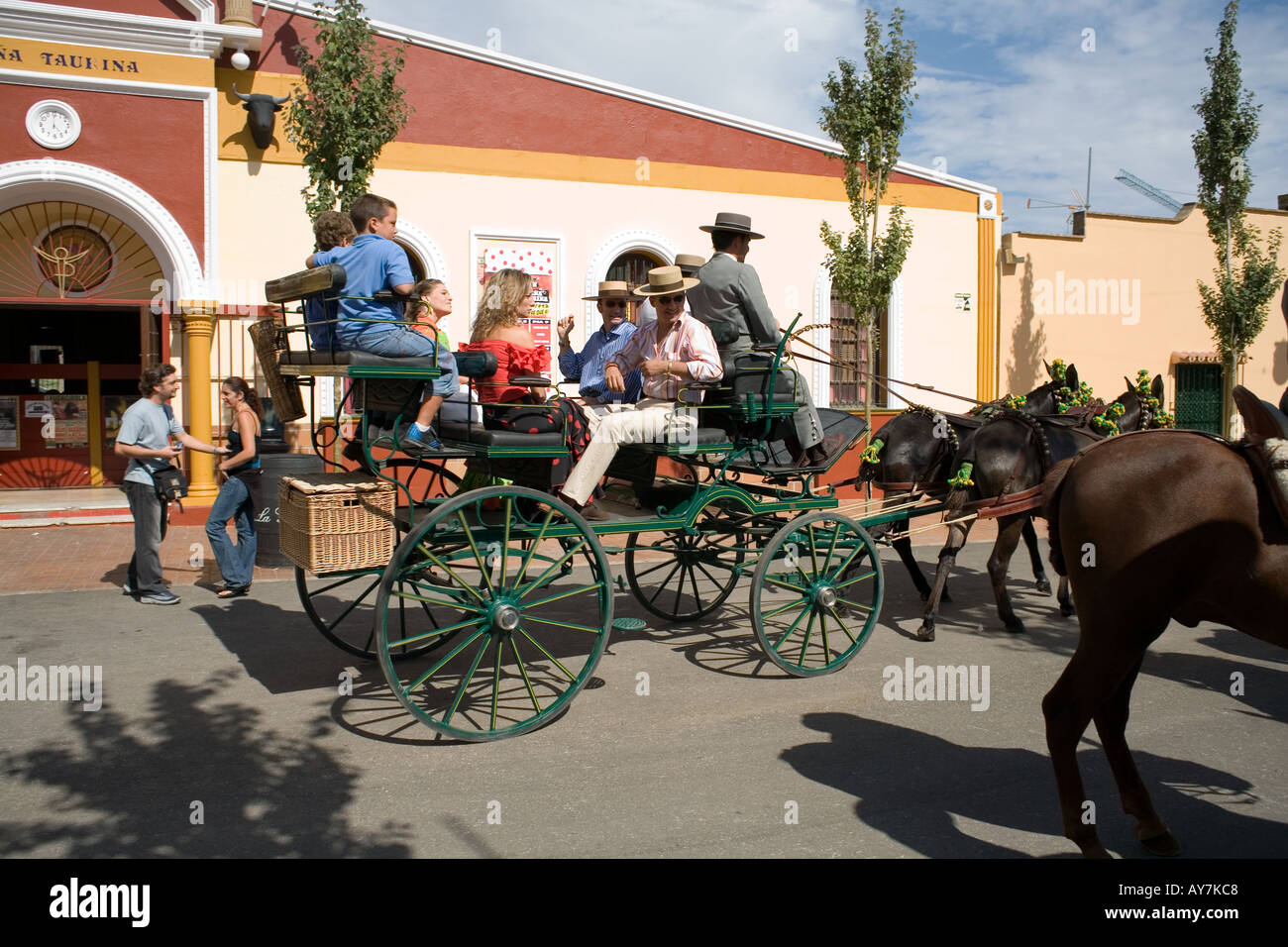 Spanish Family riding in an open horse drawn carriage - Fuengirola ...