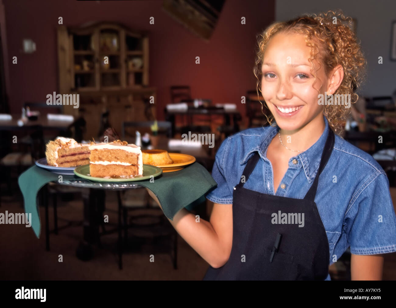 A young teenage girl serving treats and sweets at the New Mexico Farm ...