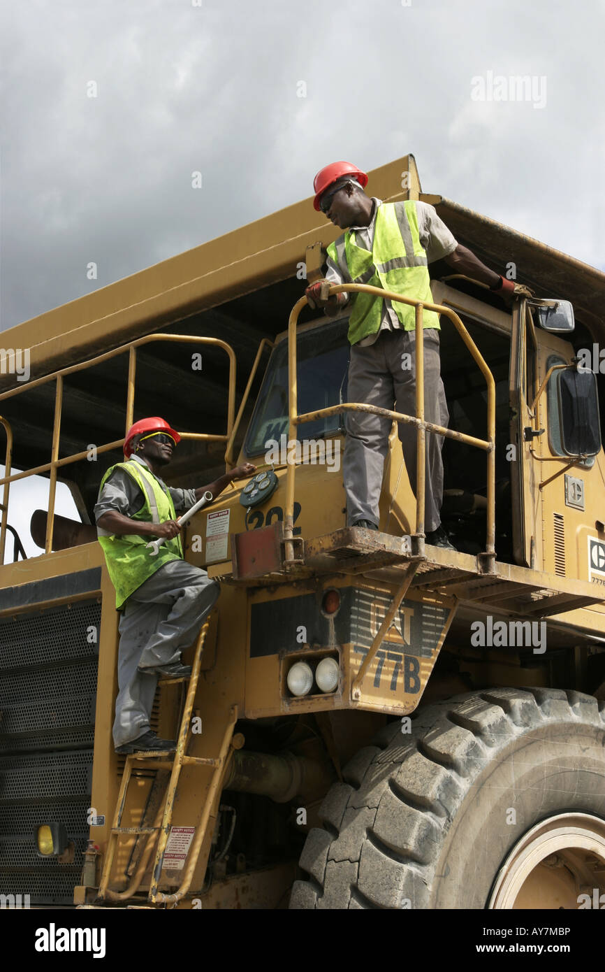 Driver and automotive engineer in discussions on Caterpillar haul truck ...