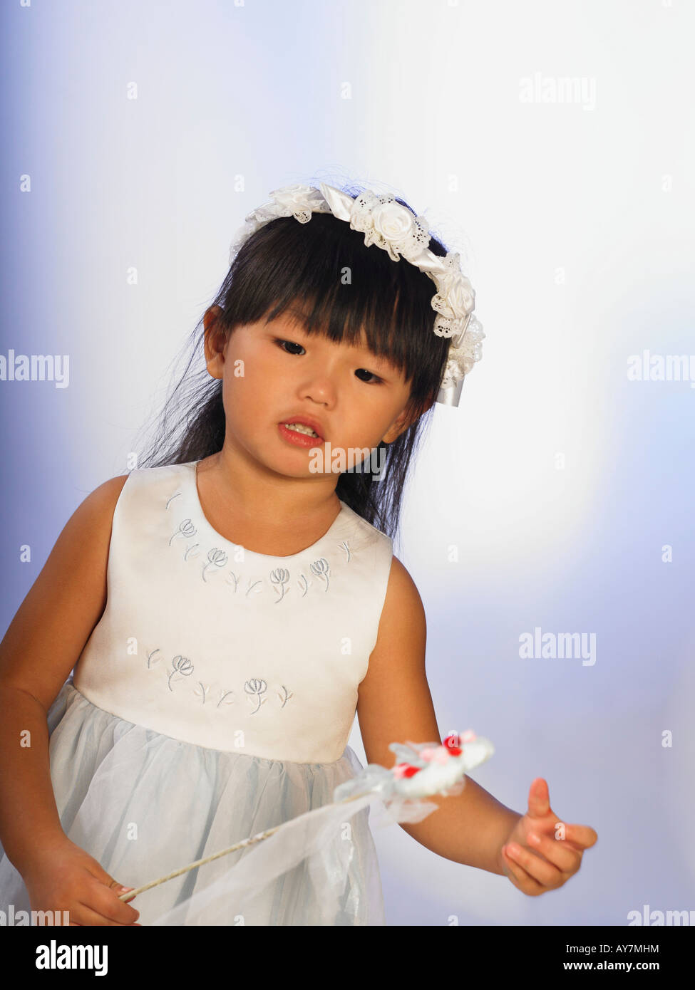 Playing with her little magic stick Stock Photo - Alamy