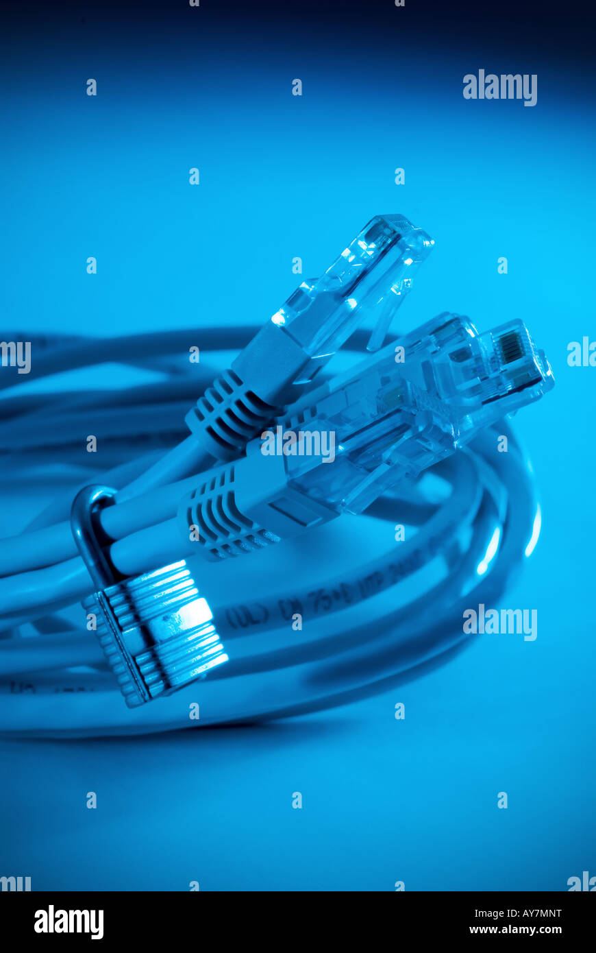 A high tech blue tint closeup of nertwork cables surrounded by a ...