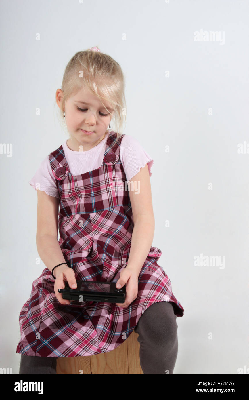 Little girl playing a video game Stock Photo - Alamy