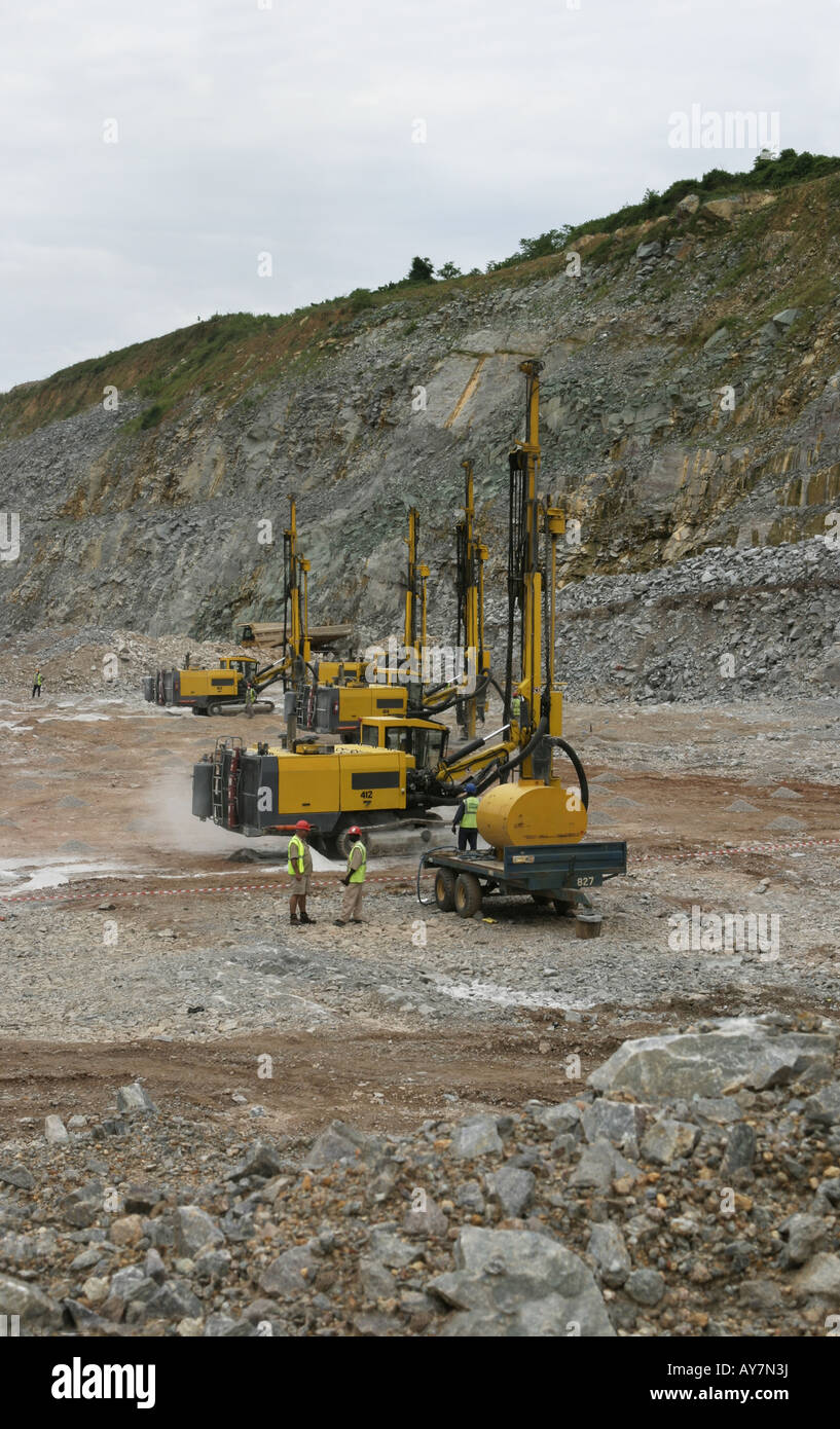 Drill rigs in opencast gold mine, preparing for blasting by drilling ...