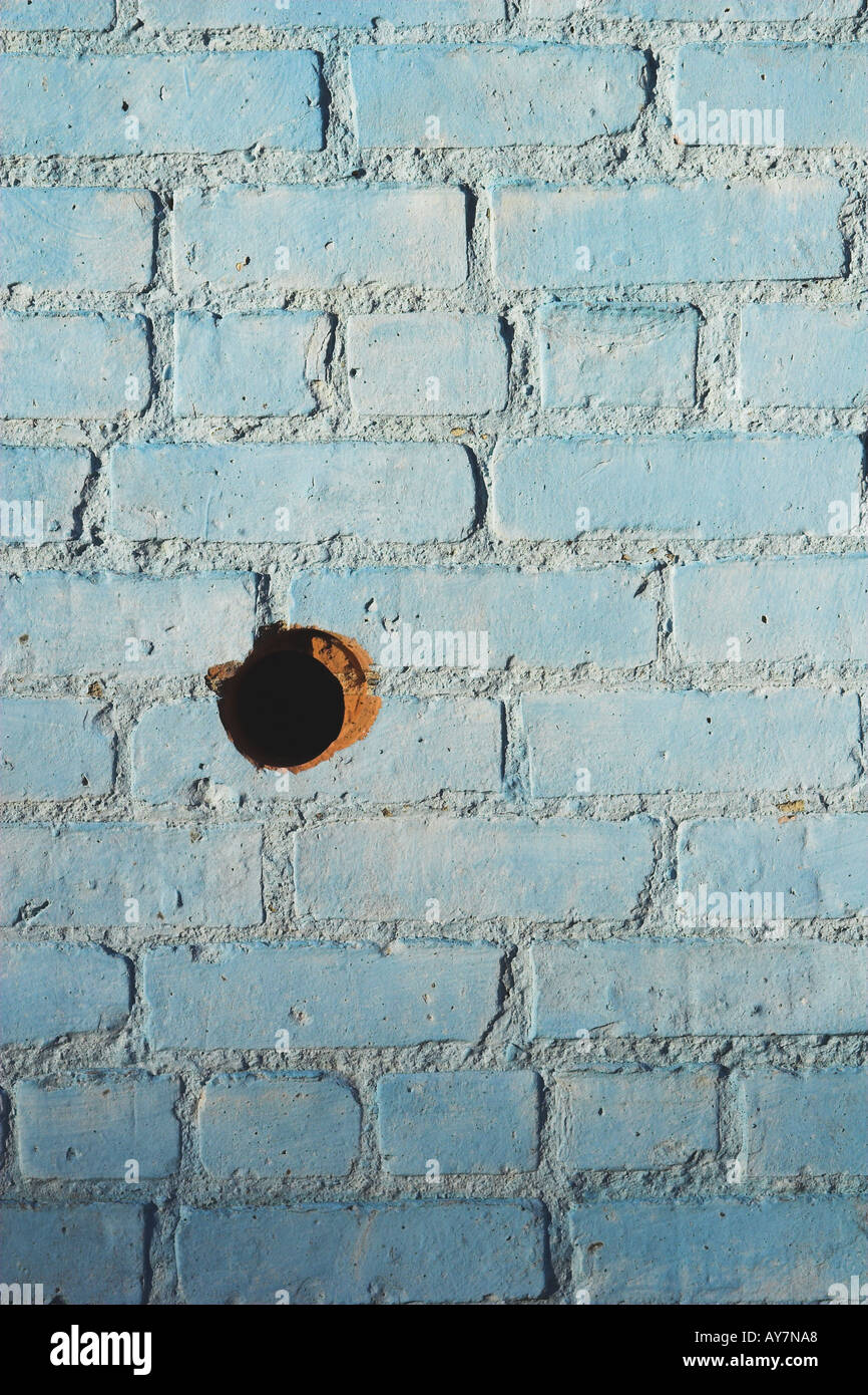 Holes in brick walls Stock Photo - Alamy