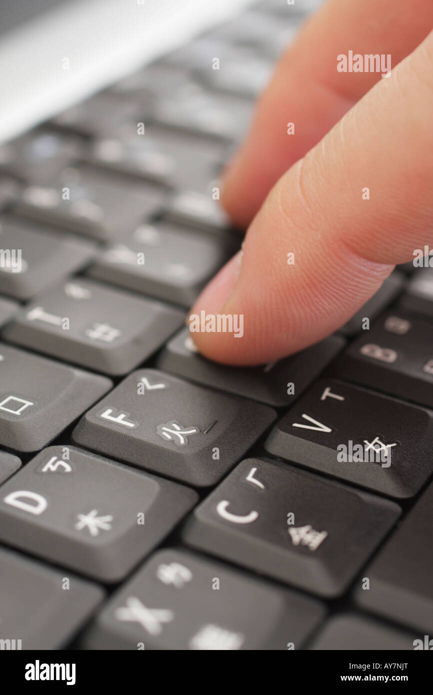 Close Up Of Person's Fingers Pressing Laptop Keyboard With English And ...