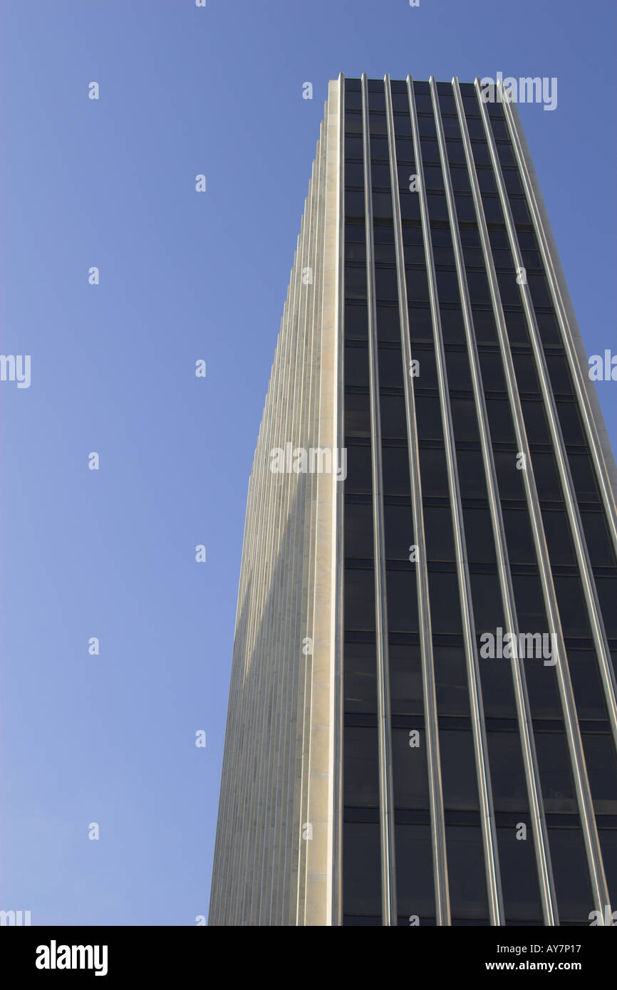 Towering office building shot from low point of view looking upwards ...