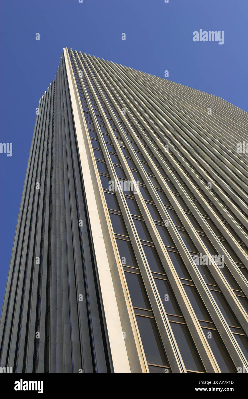 Towering office building shot from low point of view looking upwards ...