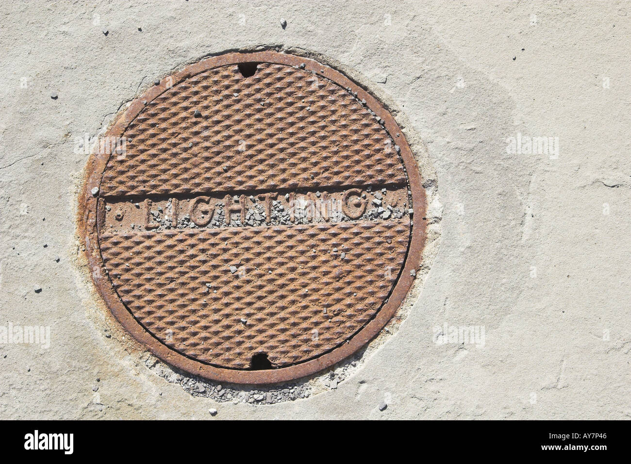 Horizontal image of manhole lighting cover in cement sidewalk Stock ...