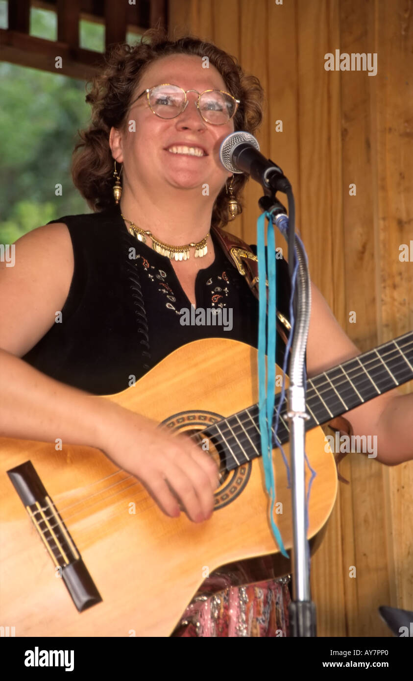 MR 0301 Smiling vocalist Marcella Garcia strums her guitar at the ...