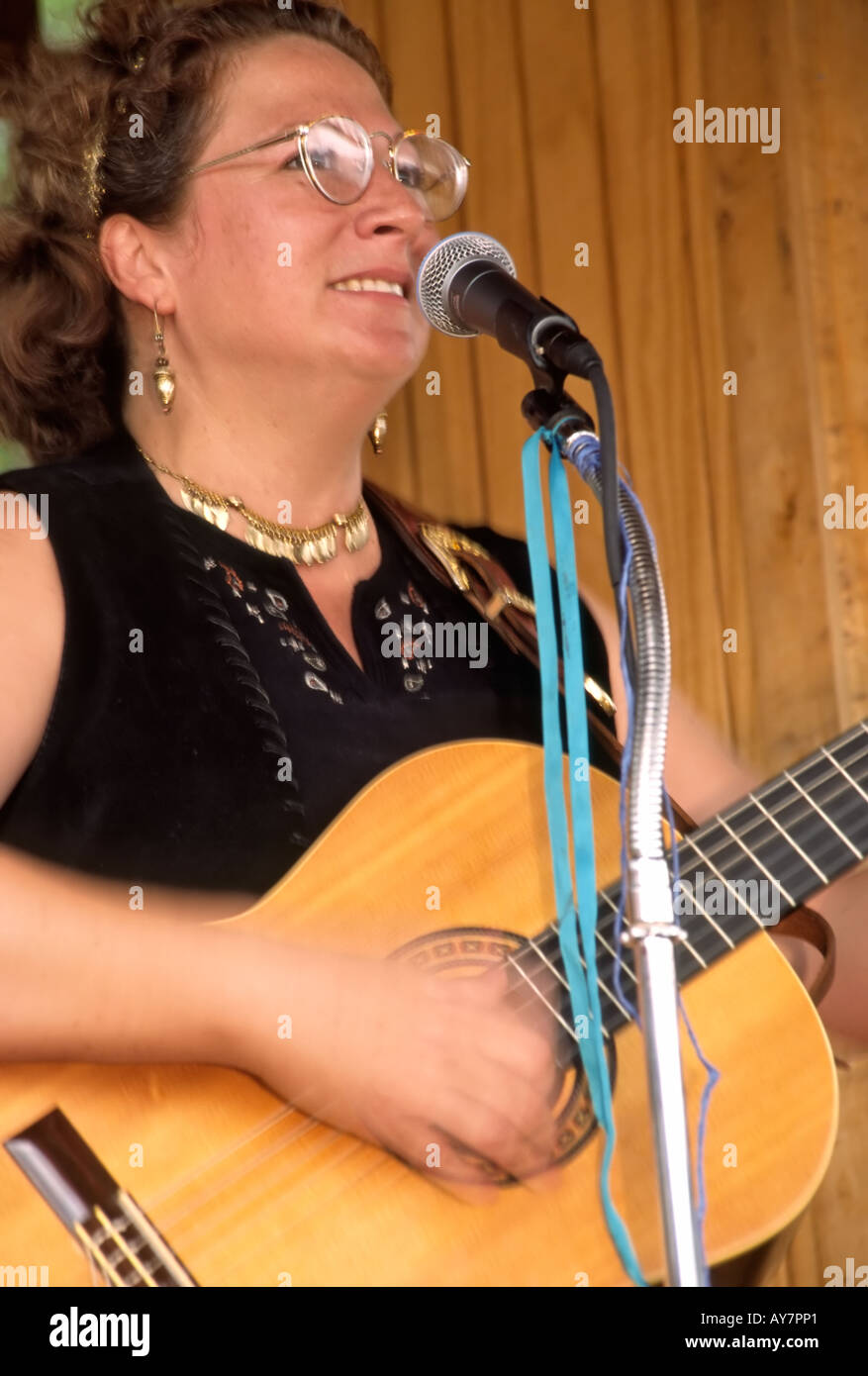 MR 0301 Smiling vocalist Marcella Garcia strums her guitar at the ...