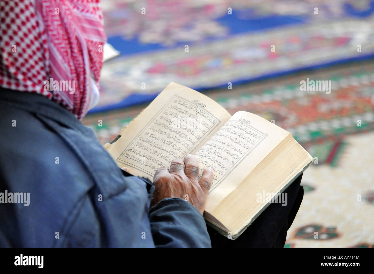 Muslim man reading quran in the mosque hi-res stock photography and ...