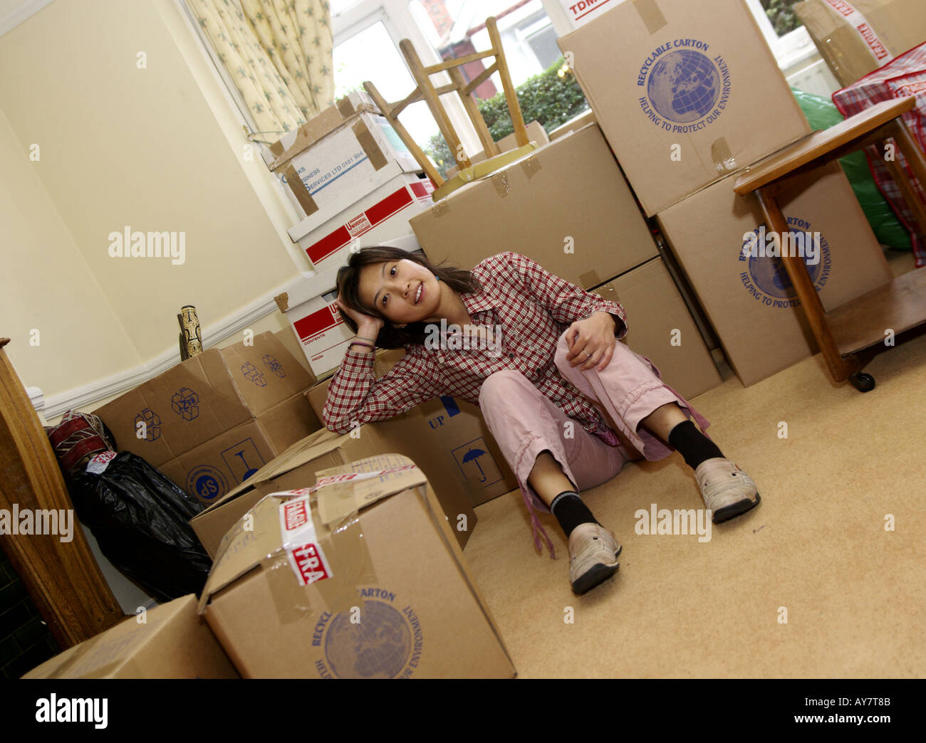 a young woman relaxes happy after move into new home Stock Photo - Alamy