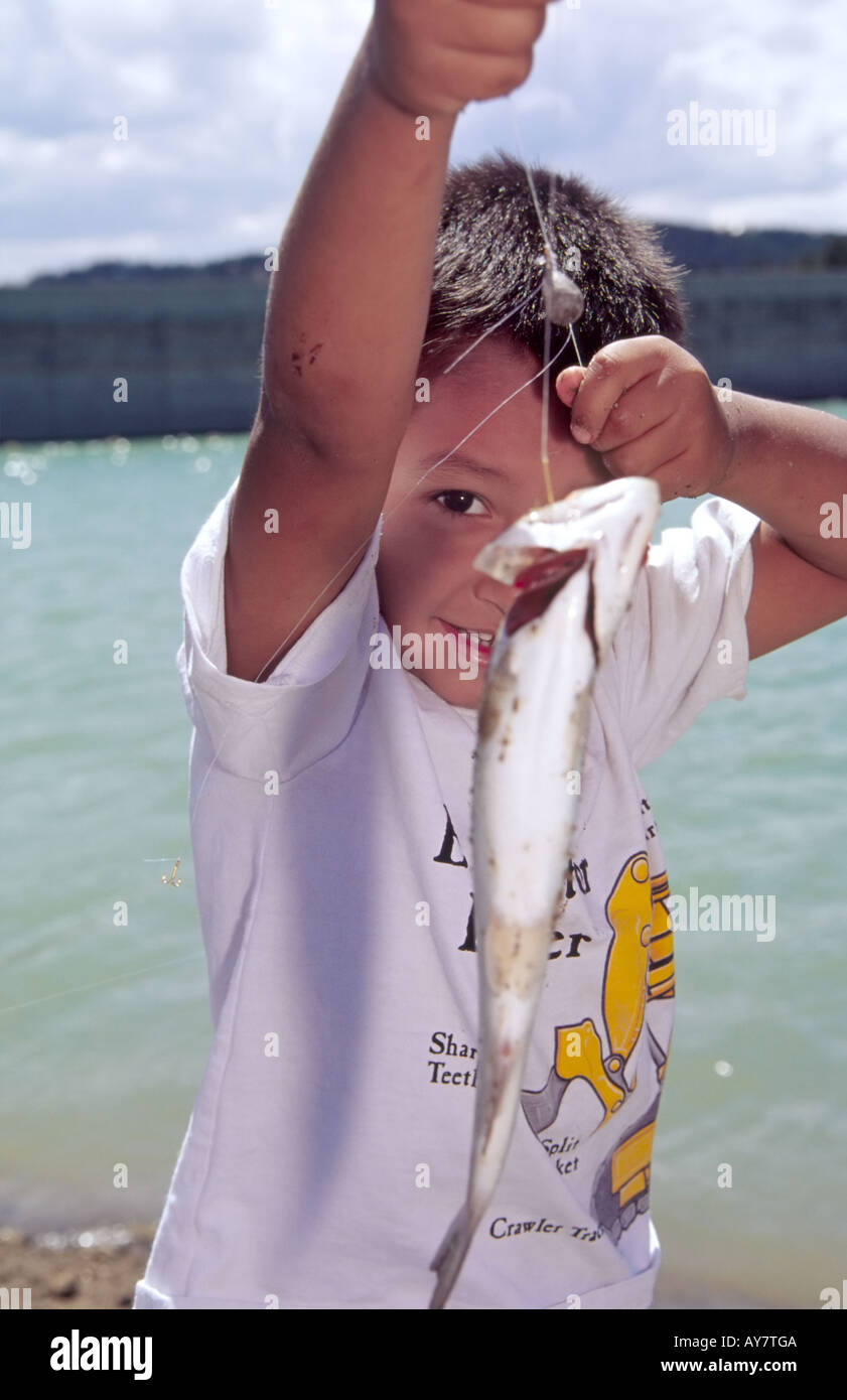 MR 592 Iasiah Soto proudly shows his fine trout catch, during Fishing ...