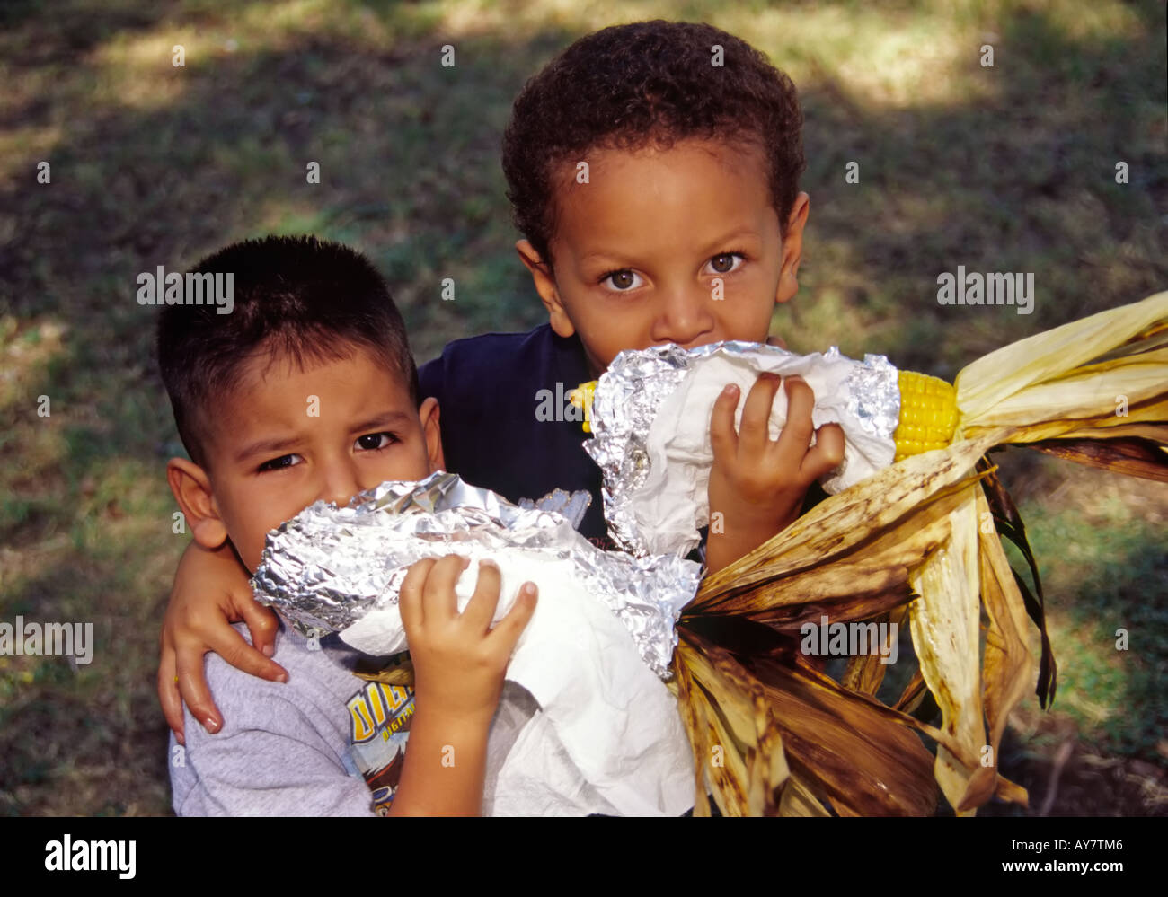 MR 696 Brothers DaSean and Michael enjoy the roasted corn on the cob ...