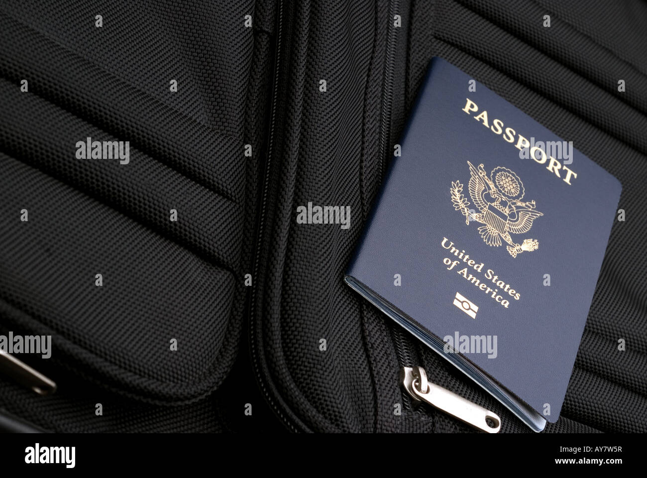Passport on a suitcase to show packing for a trip Stock Photo - Alamy