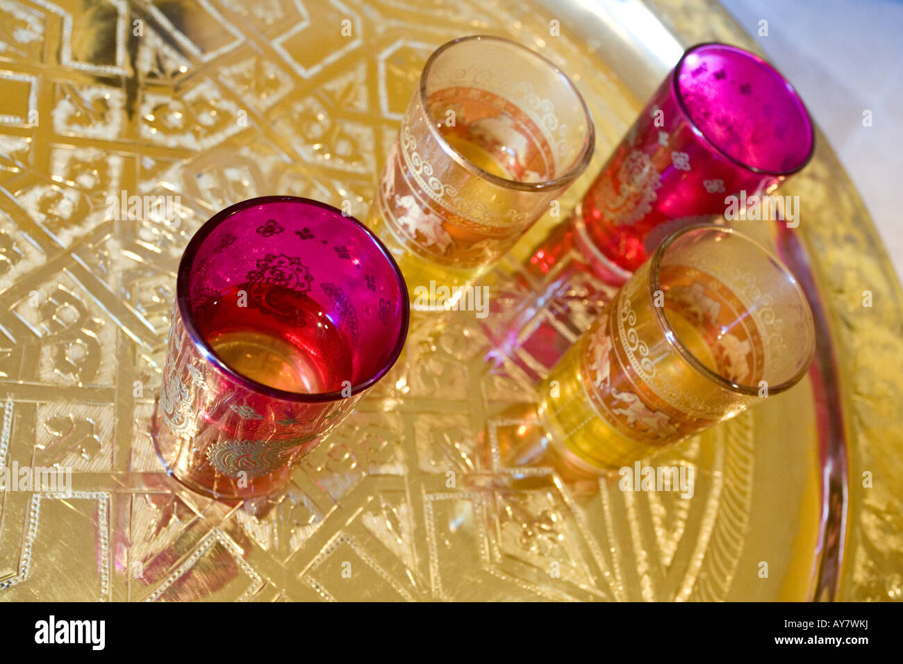 Oriental colored tea glasses on golden plate Stock Photo - Alamy