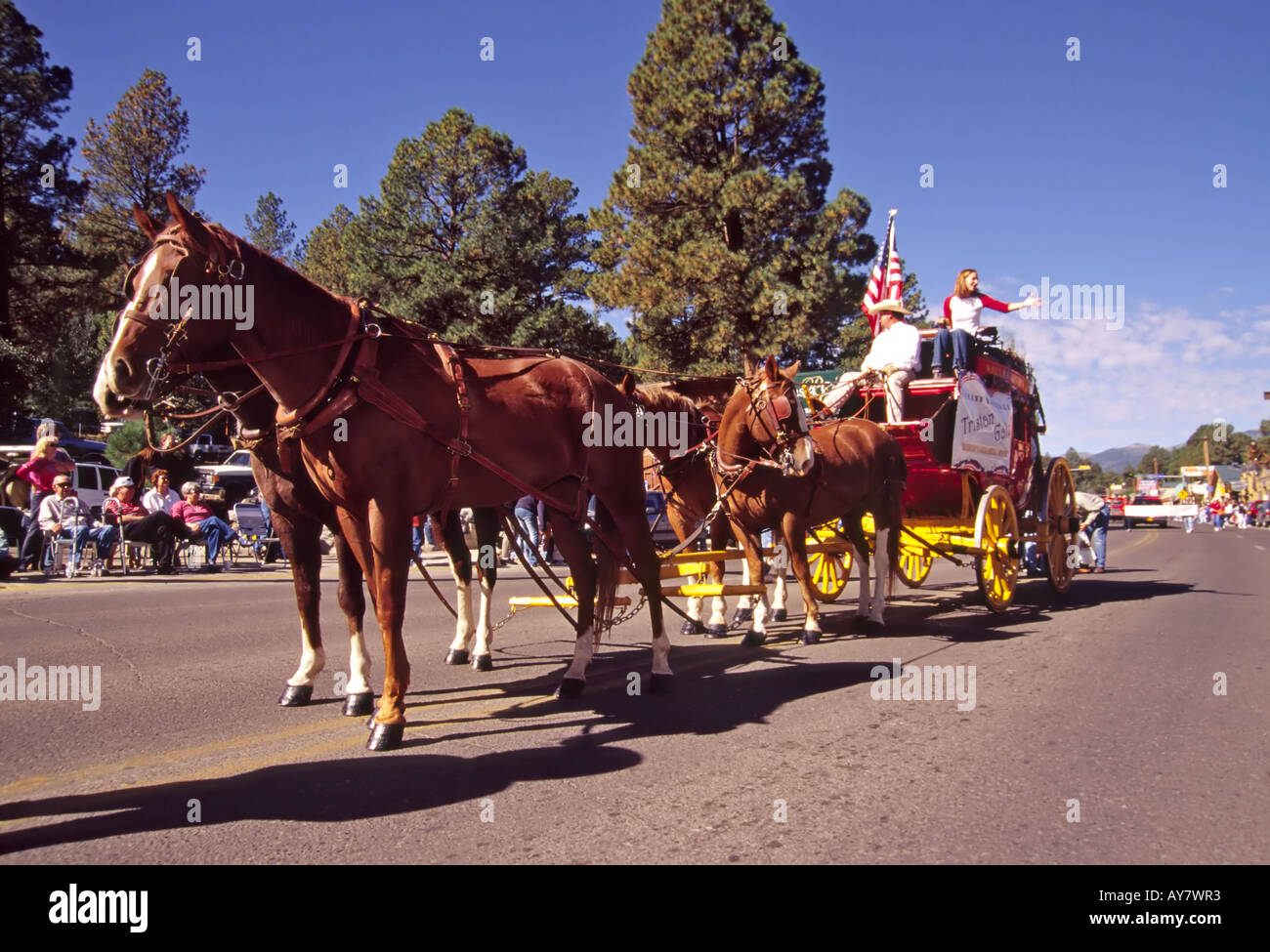 A wild west stagecoach rolls along main street at the Aspenfest Parade ...