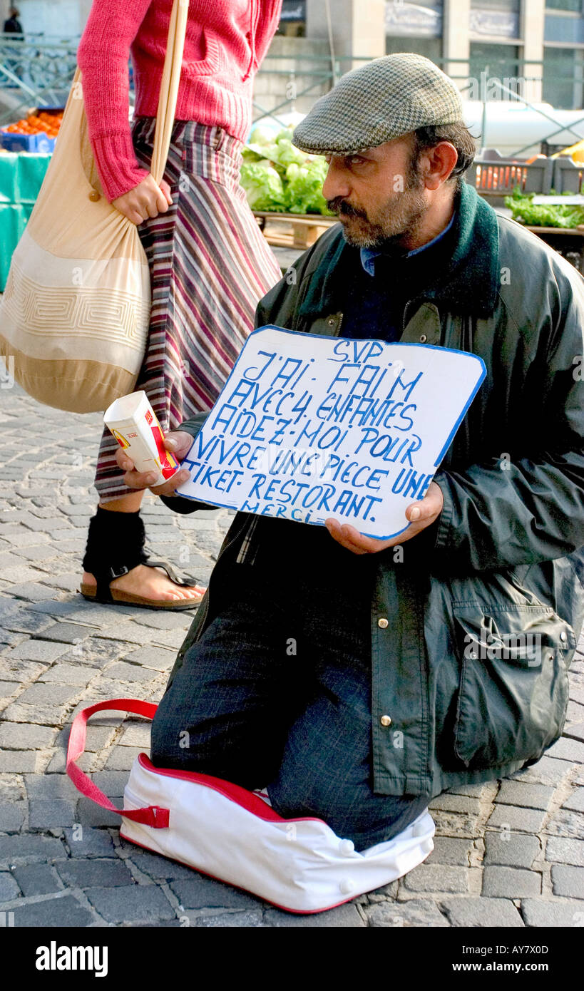 Homeless man begging for coins money in france street Stock Photo - Alamy
