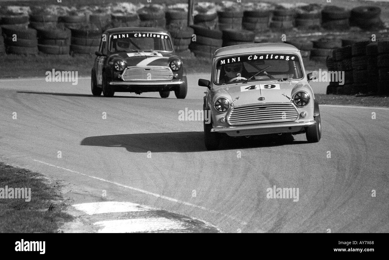 Two classic Mini cars racing at Cadwell Park Stock Photo - Alamy