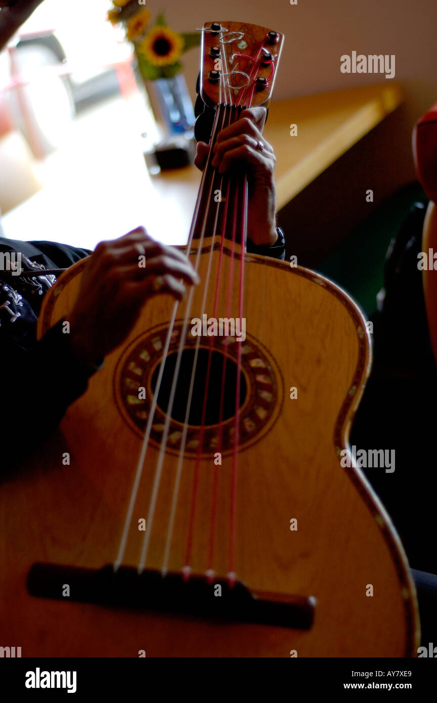 Musician playing guitar at Mexican mariachi band Stock Photo - Alamy