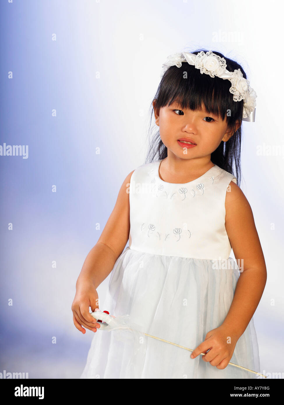 A child playing with magic stick, looking at something Stock Photo - Alamy