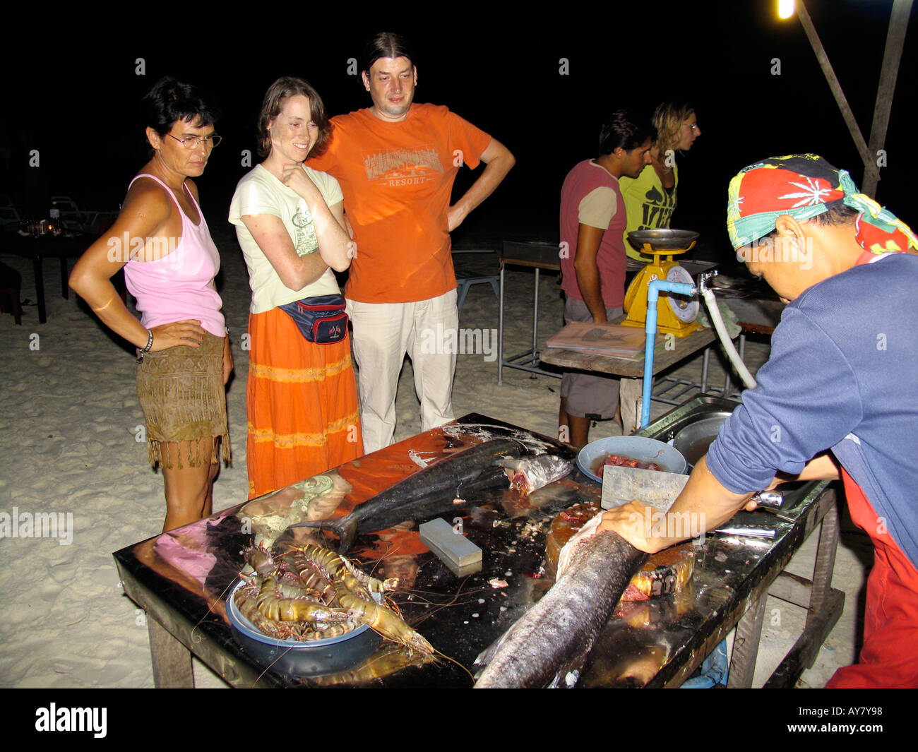 Man cuts shrimp seafood hi-res stock photography and images - Alamy