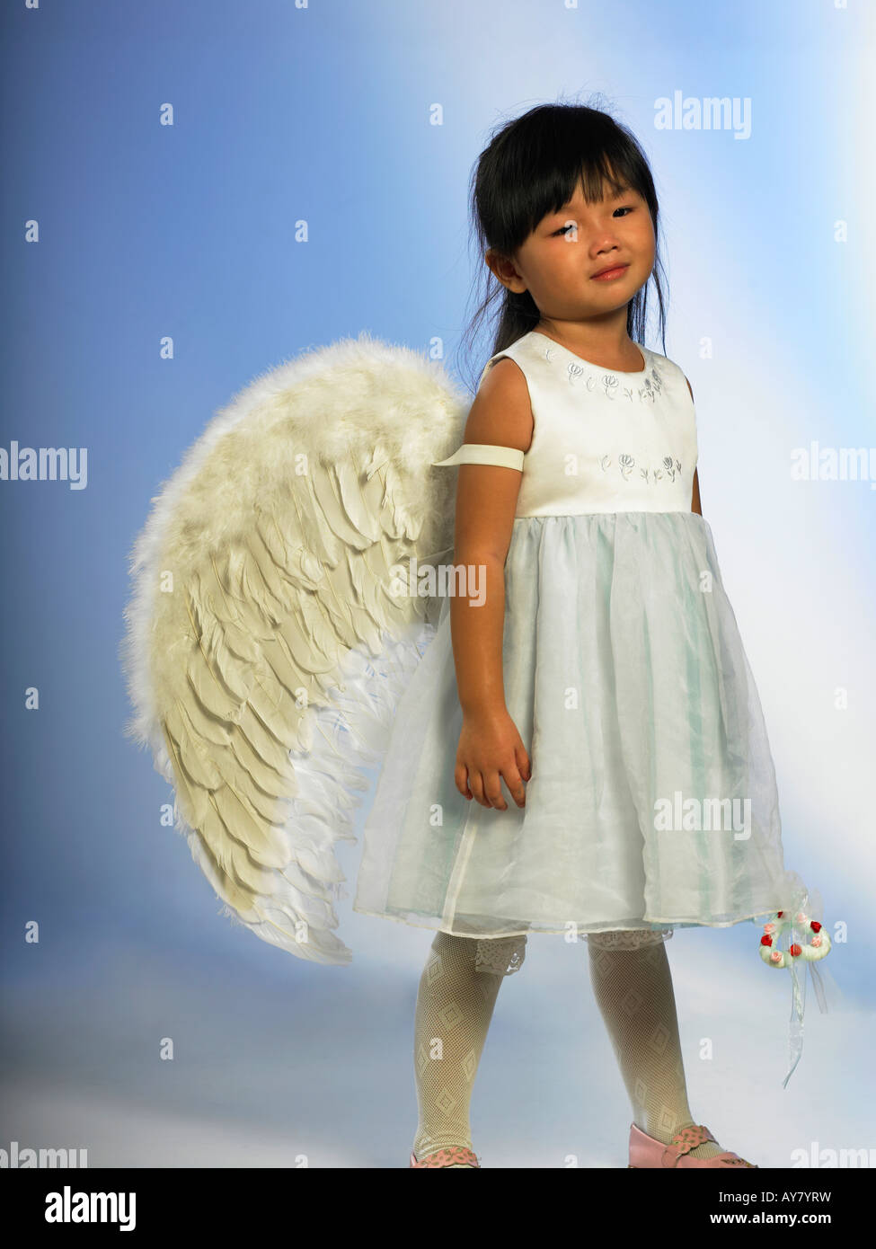 Little angel with her wing Stock Photo - Alamy