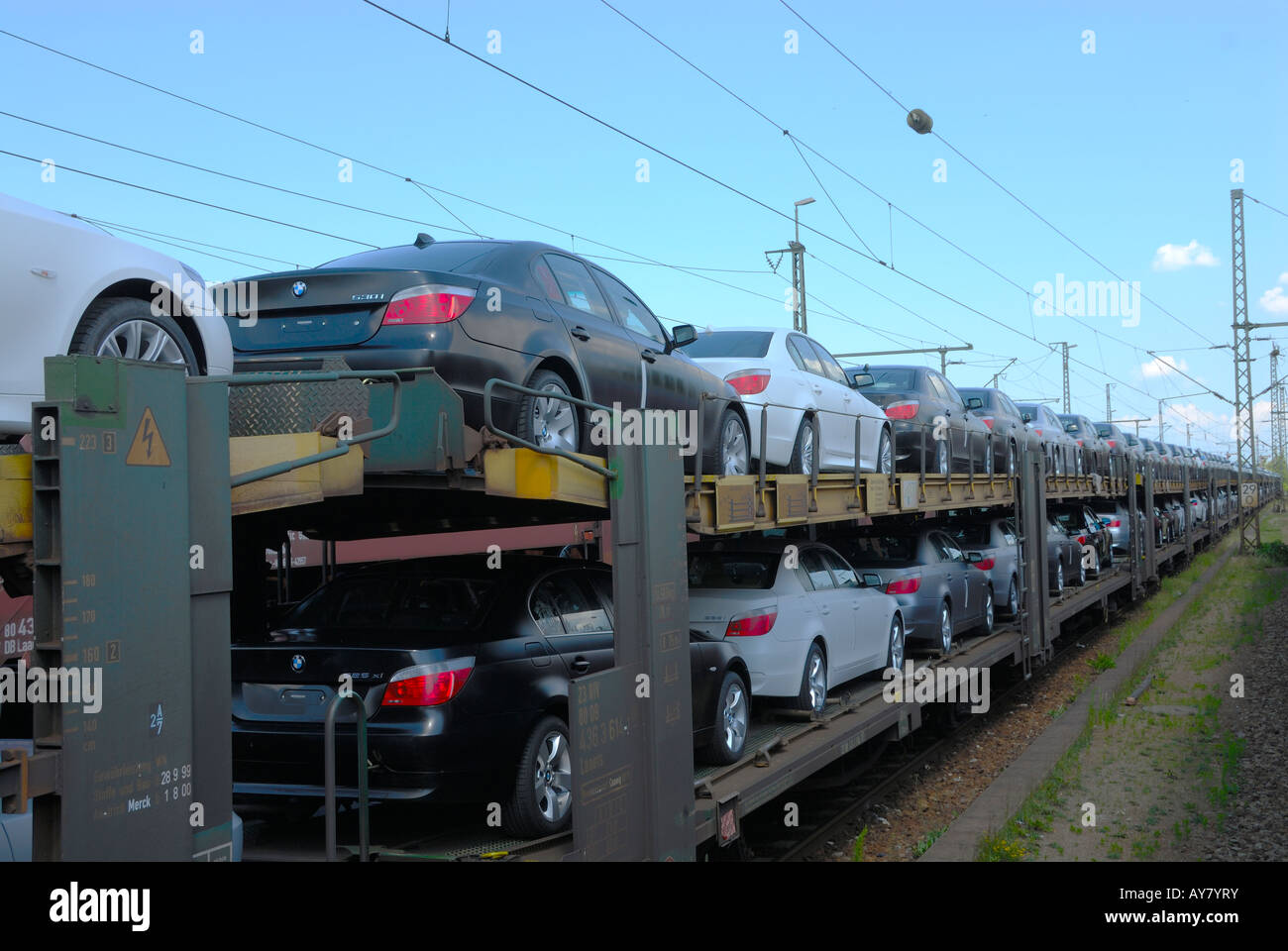 New cars are beeing transported by train Stock Photo - Alamy