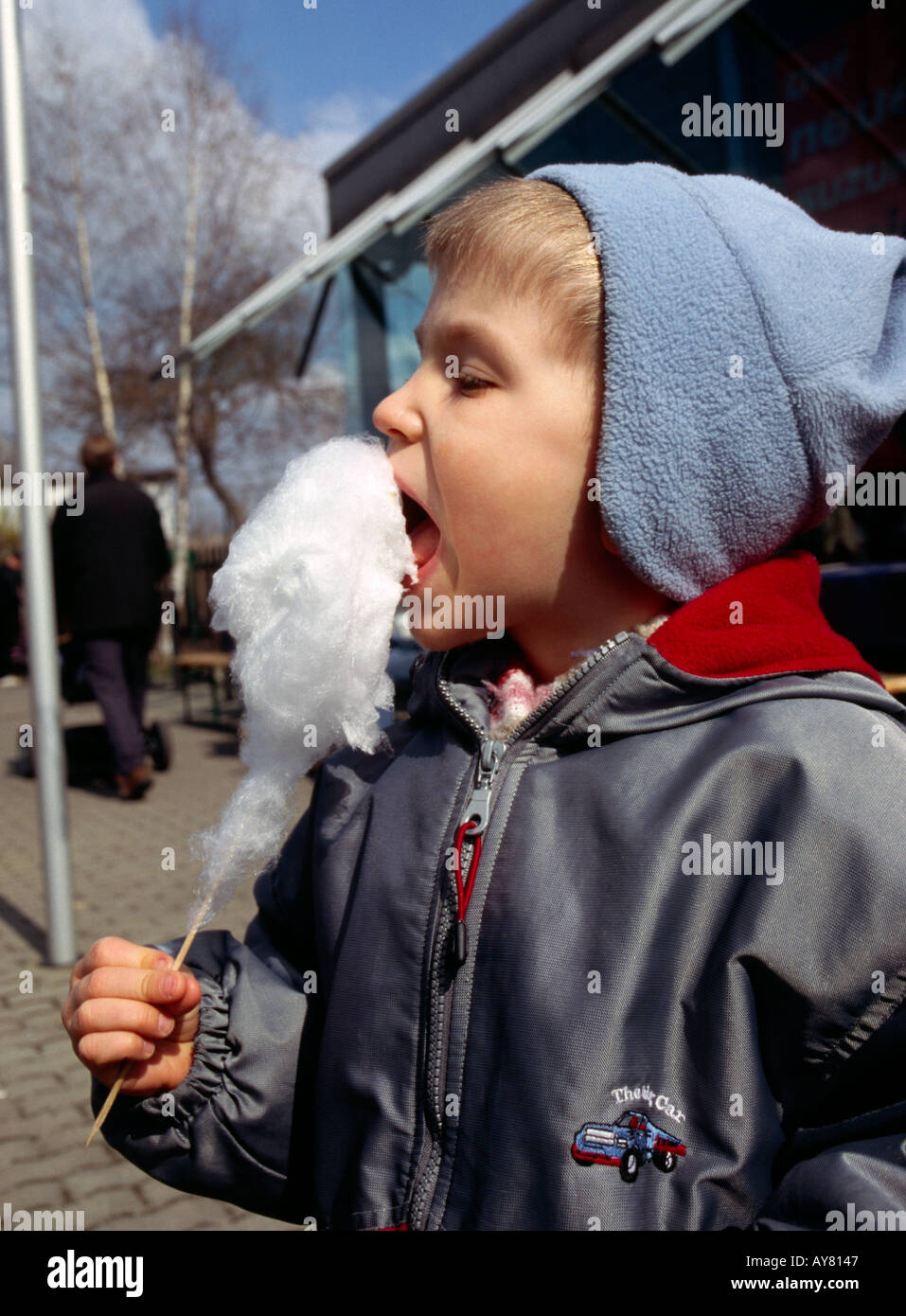 Child boy eating candy floss hi-res stock photography and images - Alamy