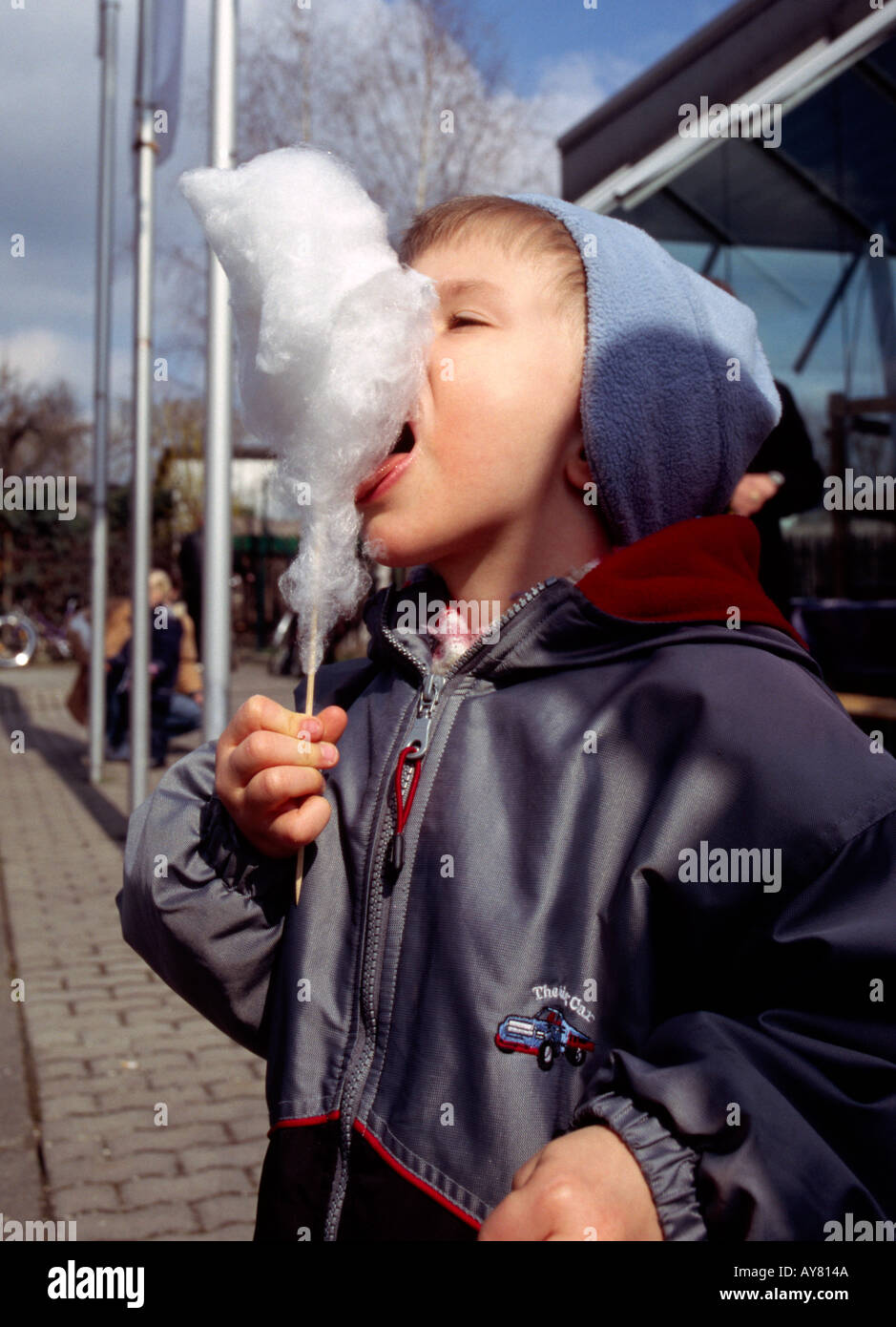 Boy eating candy floss hi-res stock photography and images - Alamy