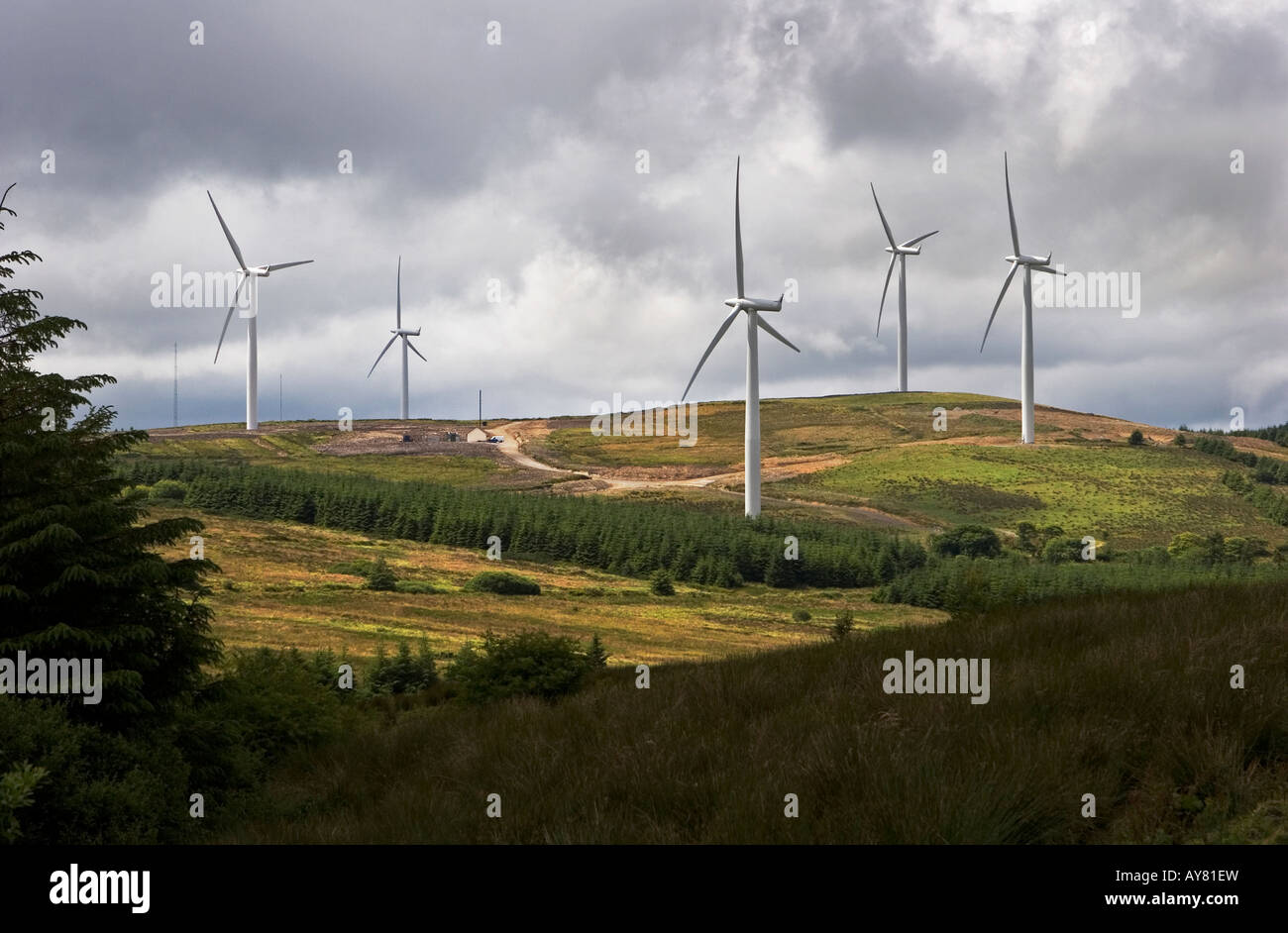 Wind power turbines on windfarm producing electricity for part of ...
