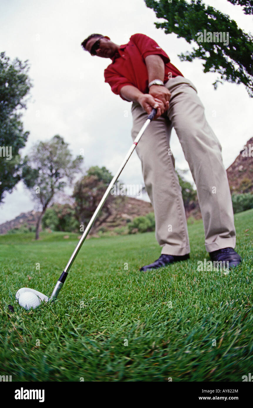 Male golfer in action Stock Photo - Alamy
