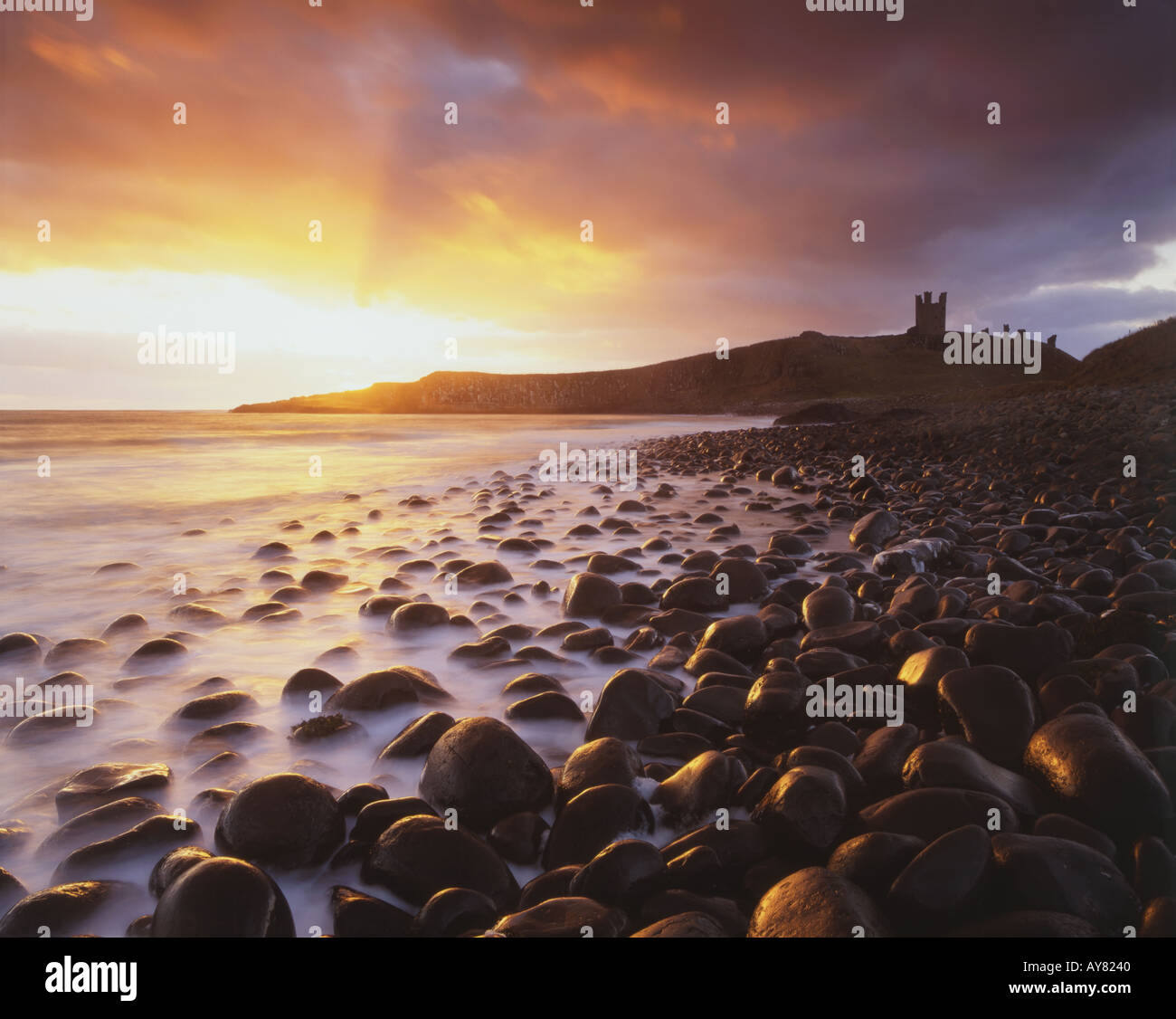 Dunstanburgh Castle from Embleton Beach Northumberland Stock Photo - Alamy