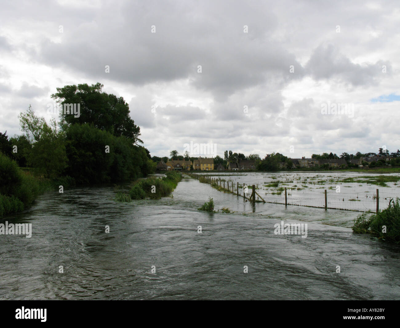 View of the River Coln flooding into the adjacent field shot from the ...