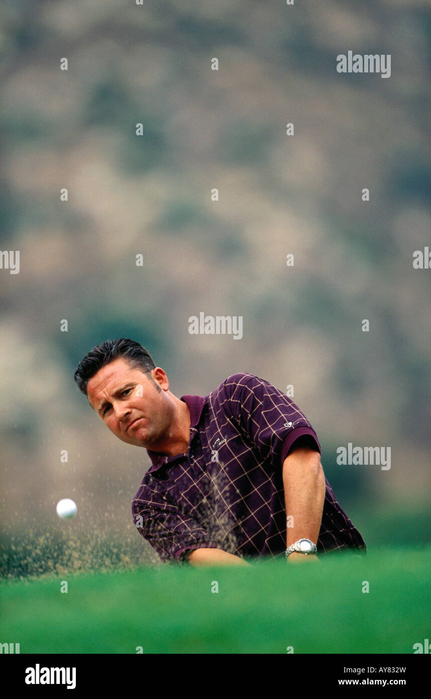 Male golfer in action Stock Photo - Alamy