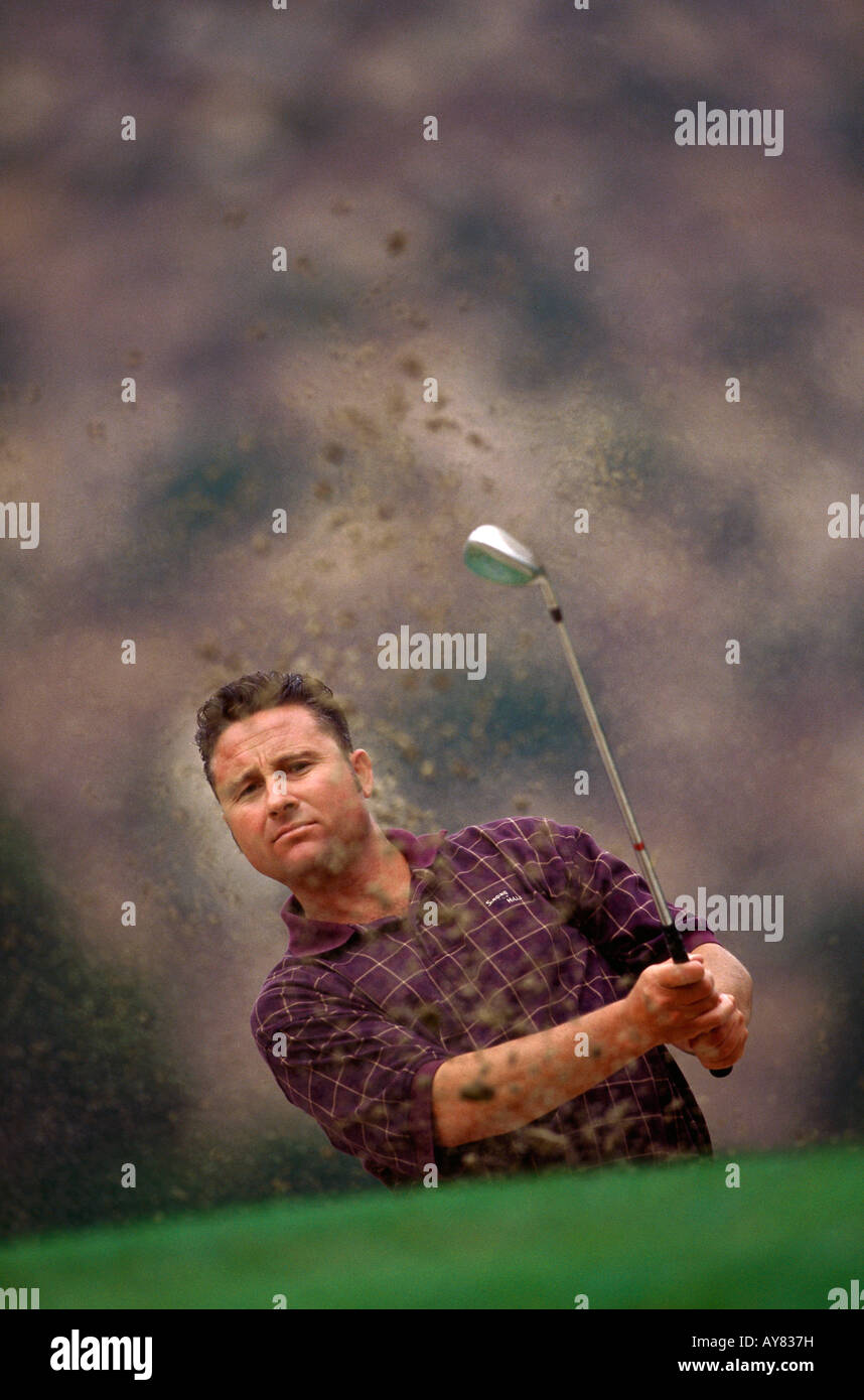 Male golfer in action Stock Photo - Alamy